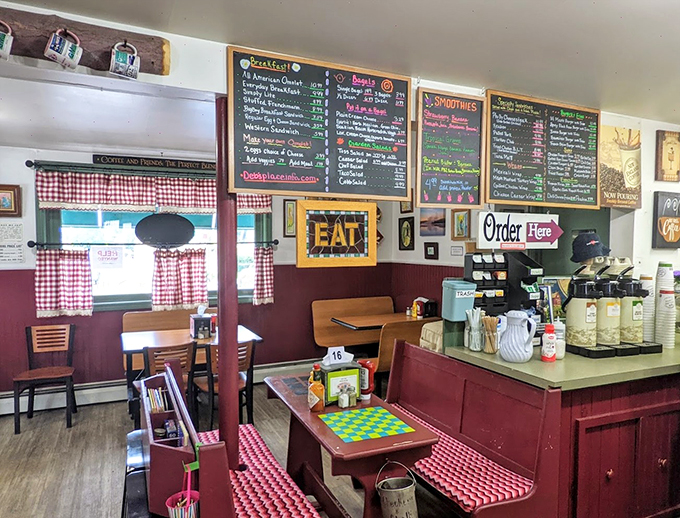 Red and white checkered curtains, chalkboard menus, and cozy booths create the quintessential small-town deli atmosphere we all crave.
