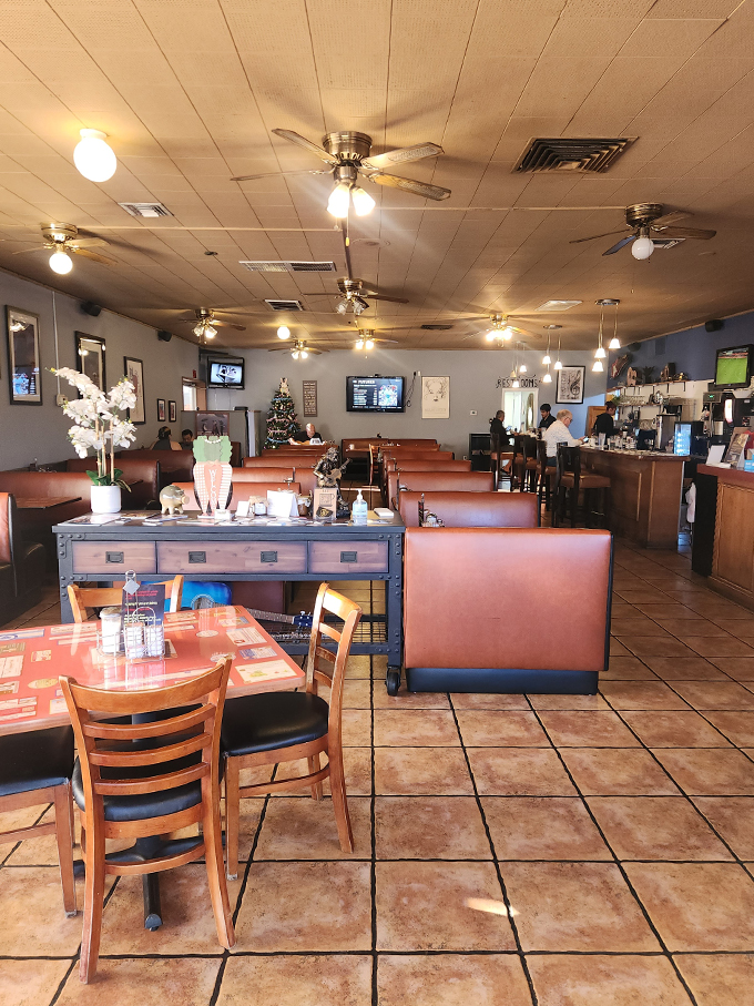 Step into a time machine disguised as a diner! The interior of 5th Avenue Cafe is a nostalgic journey, where ceiling fans spin tales of comfort food and good company. Photo credit: Jim M