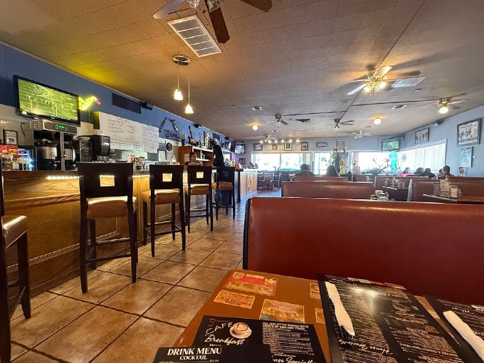 Cozy blue walls, leather booths, and pendant lighting create the perfect backdrop for morning conversations and endless coffee refills. Photo credit: Skipper Janczewski