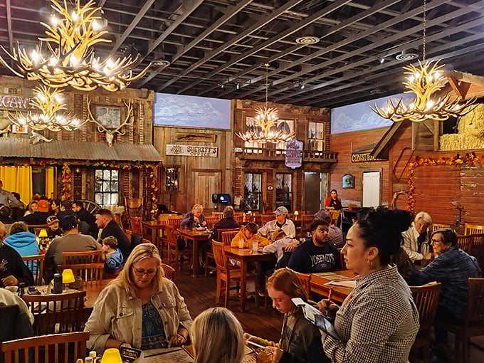 Step into a time warp where John Wayne meets modern comfort. Antler chandeliers and rustic decor create an atmosphere that's pure cowboy magic. Photo credit: Justin Wayne