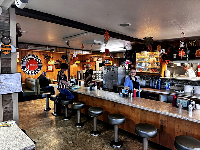 Step into a time machine disguised as a diner. Wood paneling, vintage signs, and the aroma of coffee transport you to a simpler era. Photo credit: Michael D.