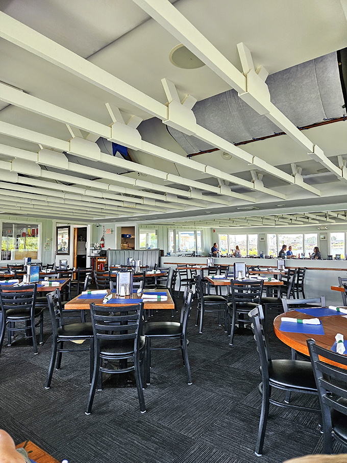 Step inside and feel the ocean breeze! This airy dining room is where seafood dreams come true. It's the nautical equivalent of your grandmother's warm hug.