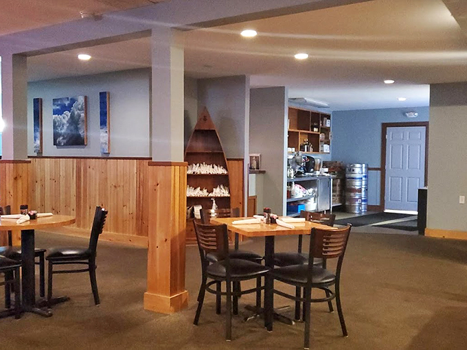 Knotty pine walls and warm lighting create the perfect backdrop for both game-day celebrations and intimate seafood feasts. Photo credit: Walter Pedro Moura