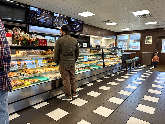 Step into donut paradise! This display case is like a treasure chest, but instead of gold, it's filled with glazed goodness.