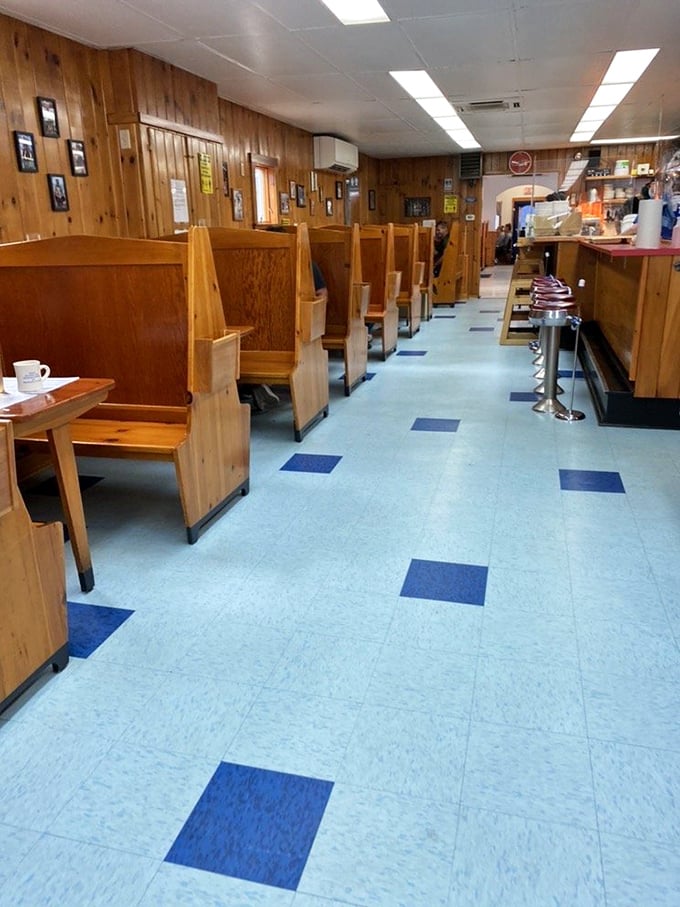 Classic wood-paneled walls and cozy booths create the quintessential Maine diner atmosphere that feels like stepping into a Norman Rockwell painting.