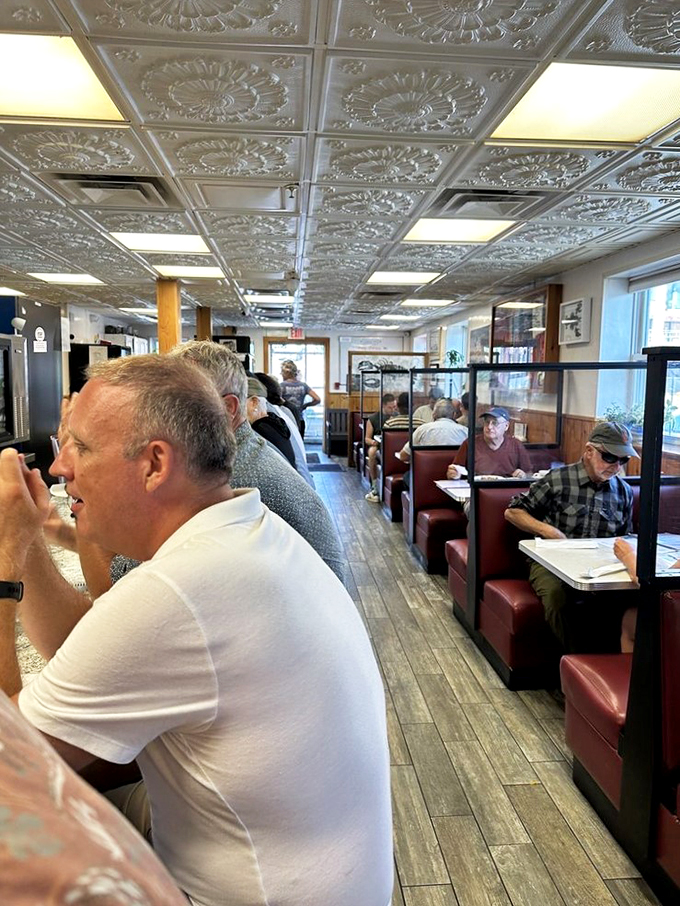 Those ornate tin ceilings and cozy booths tell stories of countless conversations and comfort food shared beneath them.