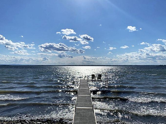 Forget the yellow brick road; this wooden walkway leads to Oz-level views. Two Adirondack chairs await, ready for you to be the king and queen of relaxation.