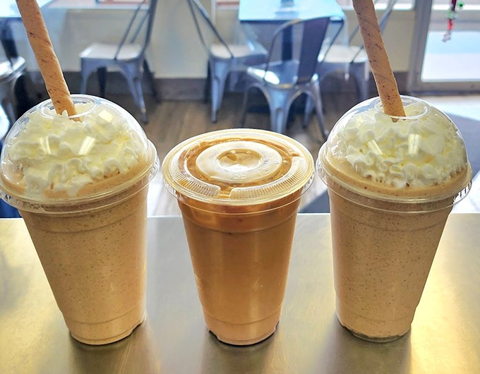 Three towering shakes crowned with whipped cream and wafer straws - because sometimes more is exactly enough.
