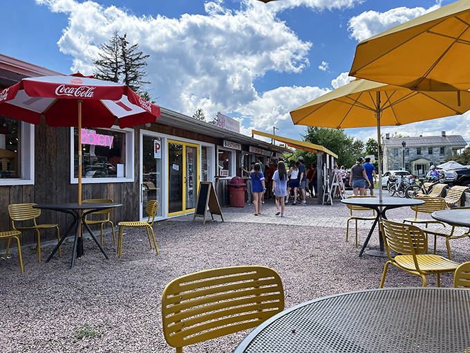 Yellow chairs dot the patio like summer dandelions, while red and yellow umbrellas create the perfect spot for ice cream contemplation.