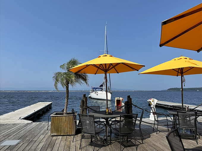 Yellow umbrellas dot the deck like sunshine, while sailboats drift by and palm trees sway in the Vermont breeze.