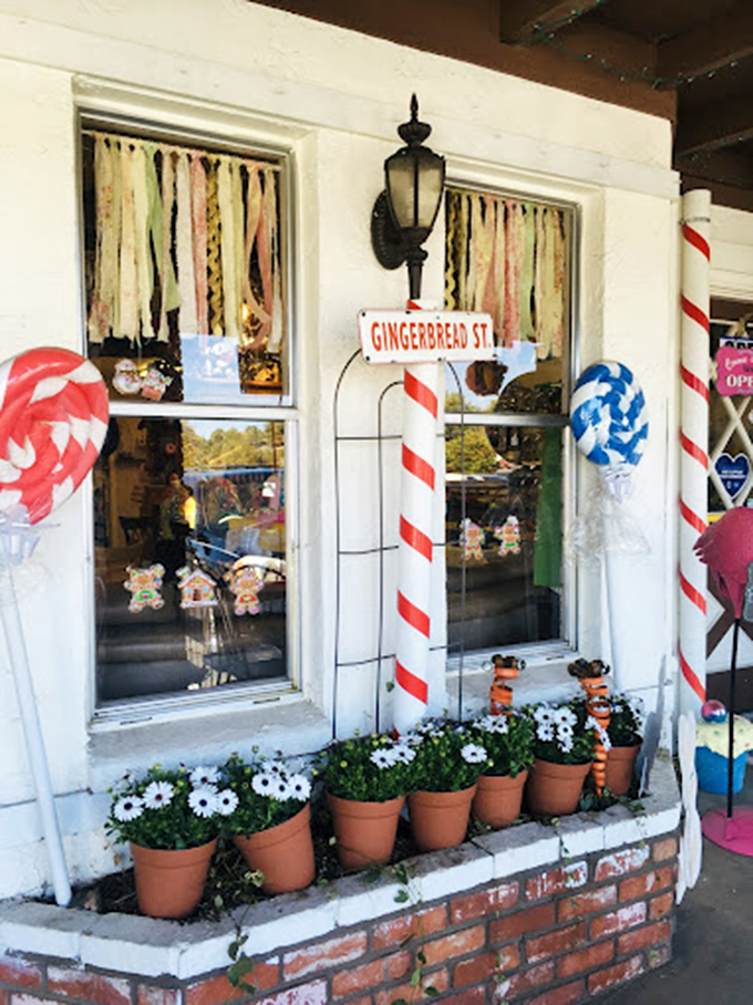 Gingerbread Street meets Main Street with these delightful candy cane posts and fresh flowers creating a sweet welcome.