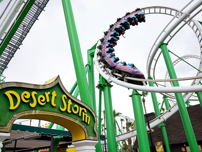 Hold onto your hats, folks! The Desert Storm coaster dares you to ride, its green and white tracks a rollercoaster enthusiast's dream come true.