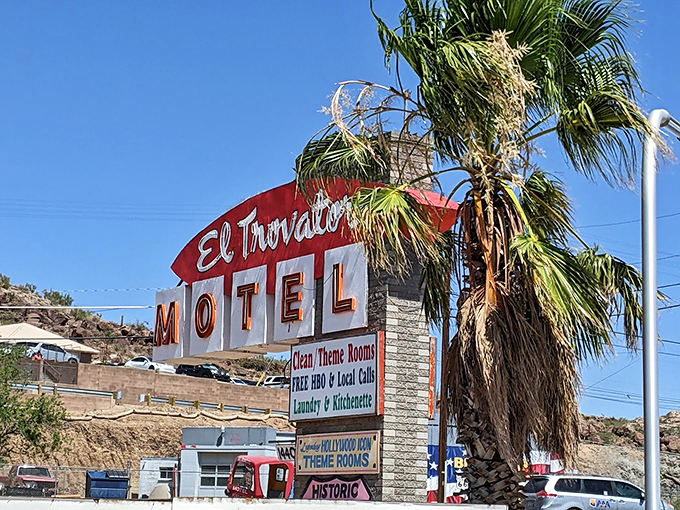 Neon dreams come true! This eye-catching sign isn't just advertising - it's a beacon of nostalgia, promising clean rooms and a slice of Americana pie. 