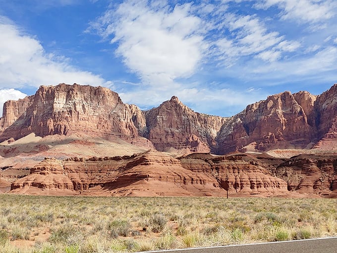 Towering vermilion cliffs stretch toward azure skies, a reminder that Mother Nature was feeling particularly ambitious in Arizona.