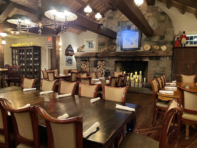 Cozy up by the fireplace! This rustic dining room feels like Grandma's house&mdash;if Grandma had impeccable taste and a flair for historic preservation.