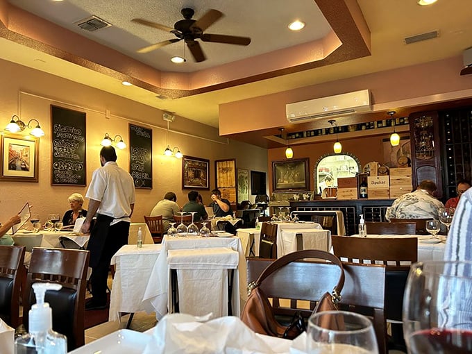 Step into a slice of Italian heaven! This cozy dining room feels like your nonna's house&mdash;if your nonna had impeccable taste and a flair for mood lighting.