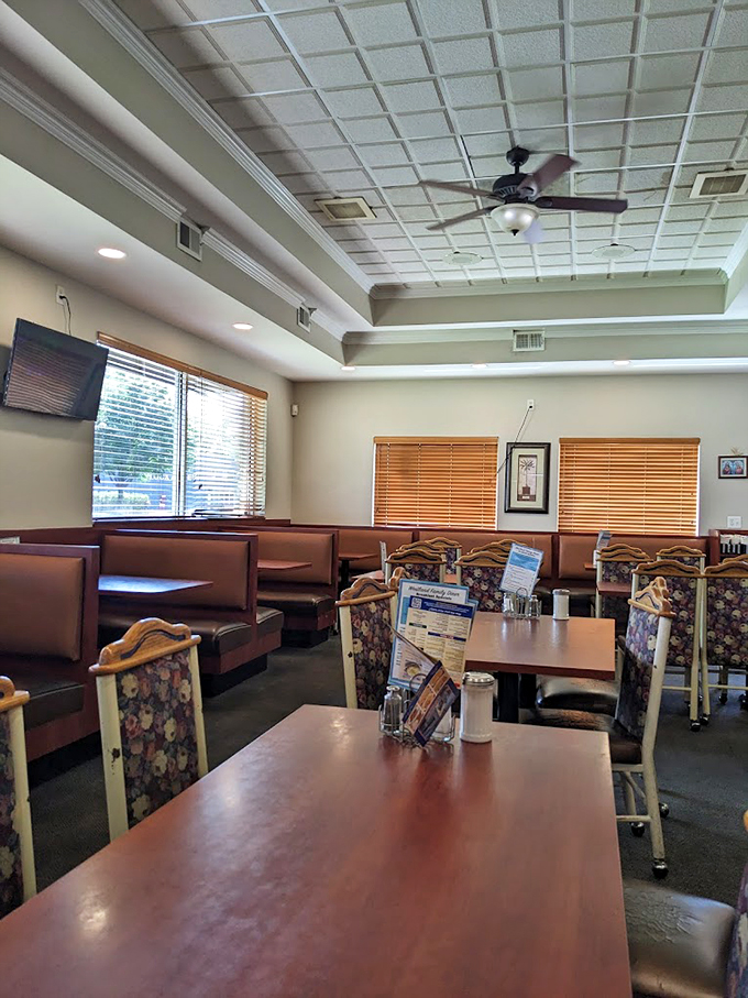 Step into a time capsule of cozy Americana. This dining room whispers tales of countless family gatherings and first dates. If these booths could talk!