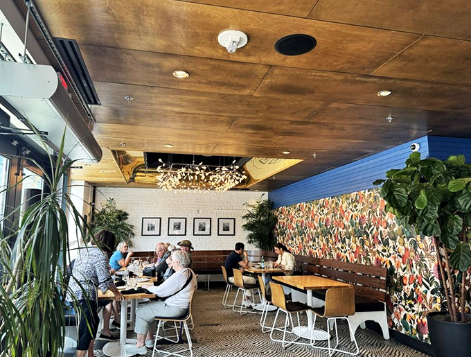 Cozy meets chic in this dining room that's part Gatsby, part modern art gallery. The chandelier alone is worth the visit&mdash;it's having its own party up there!