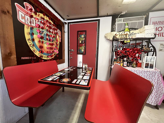 Step into a time capsule of comfort! These cherry-red booths have seen more stories than a librarian on overtime.