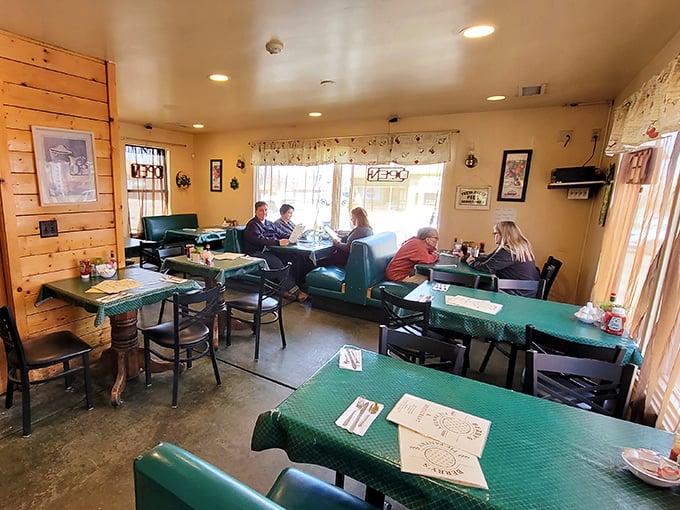 Step into a cozy time capsule where comfort food reigns supreme. This dining room is where calories fear to tread and diet plans come to die. Photo credit: Johnathan Covey II
