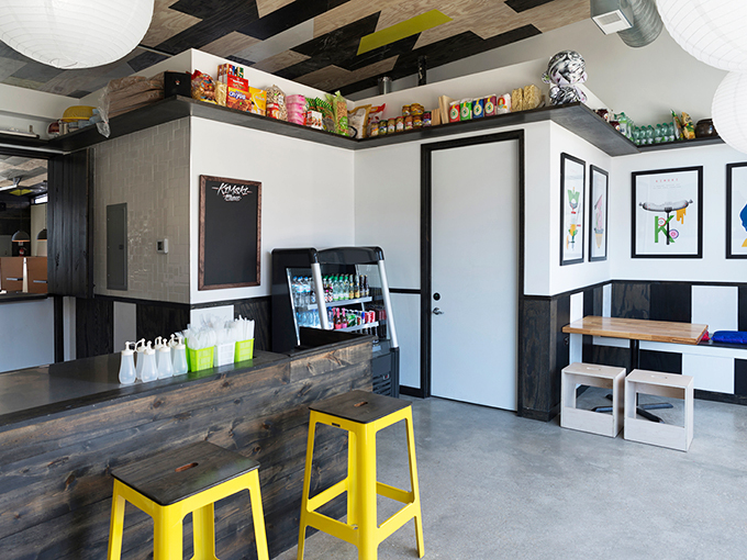 Welcome to flavor town's coolest hangout! Kimski's interior is where industrial chic meets your quirky aunt's eclectic living room.