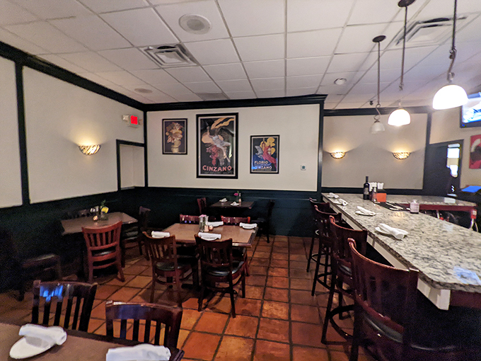 Step into a world where Cinzano posters meet comfort. This dining room whispers "date night" louder than your stomach growls. Photo credit: Maria Hidalgo Dolan