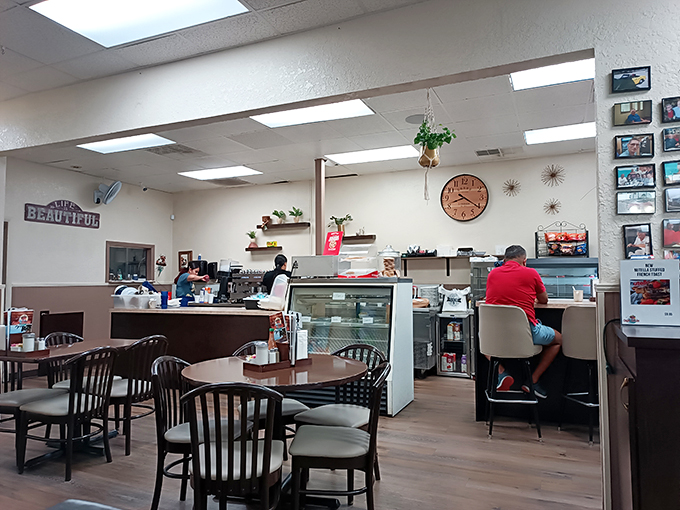 Step into a world where "Life is Beautiful" and the aroma of Cuban coffee fills the air. This cozy interior is your ticket to Havana. Photo credit: Ernesto Roubert