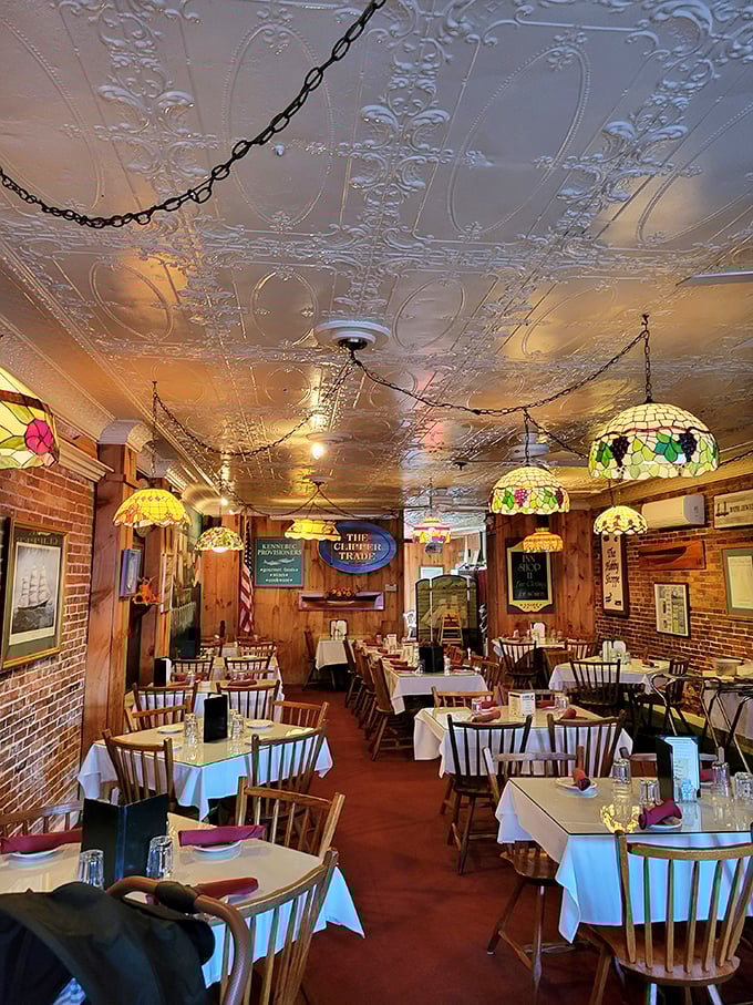 Step inside and be transported to a nautical wonderland! The ornate tin ceiling and Tiffany-style lamps create an atmosphere that's part fancy dinner party, part classy pirate ship.