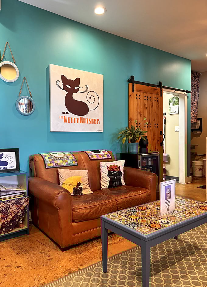 Step into a world where teal walls and cat-themed art collide. This cozy nook feels like your eccentric aunt's living room &ndash; if she had impeccable taste and a fondness for felines.