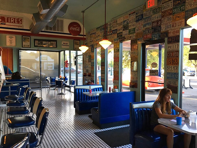 Checkered floors and license plate walls &ndash; it's like someone bottled the essence of "Happy Days" and sprinkled it all over this diner. Fonzie would approve!