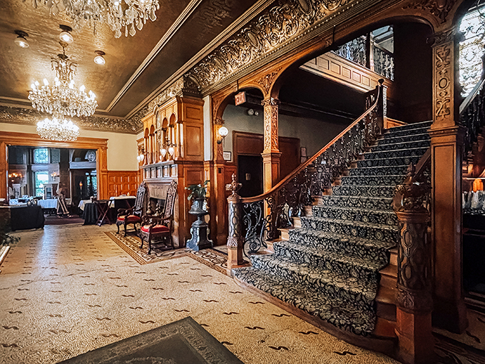 Stairway to heaven or dinner? This opulent entrance hall sets the stage for a night of Gilded Age glamour.