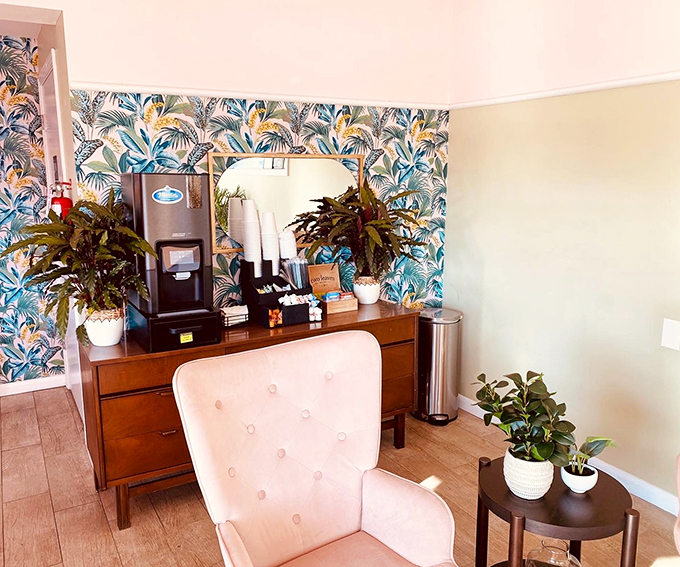 Step into a tropical time warp! This lobby's wallpaper is so lush, you might need a machete to find your way to the coffee maker.