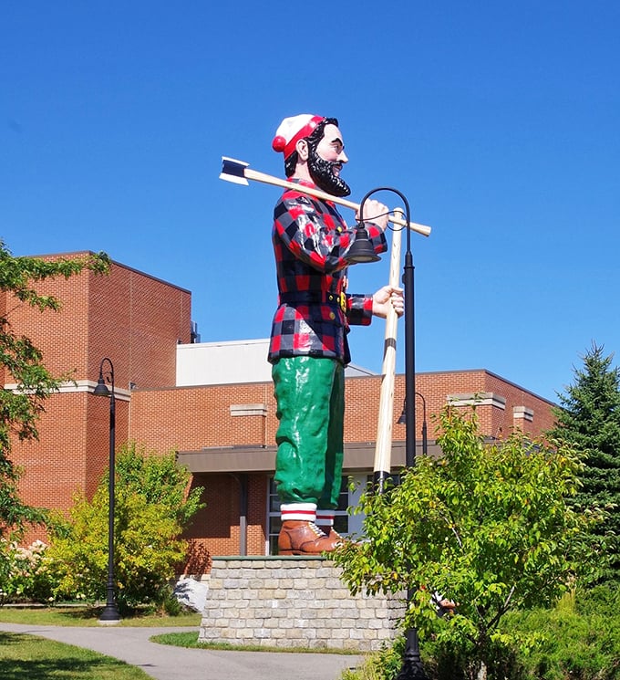 Plaid never goes out of style when you're a 31-foot-tall legend. Paul's rocking that lumberjack look with more flair than a fashion week runway.