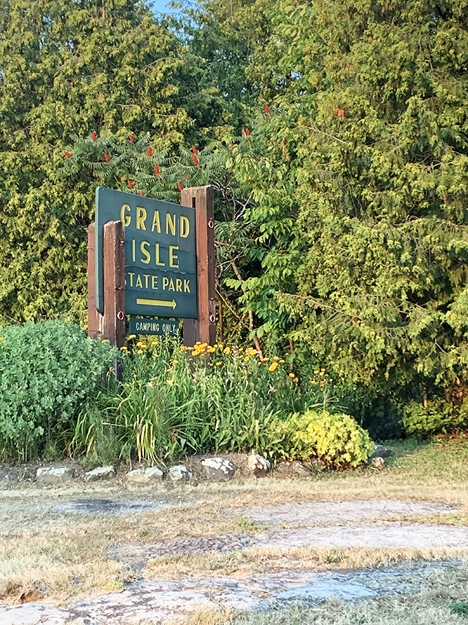 Welcome to paradise! This sign isn't just directions; it's an invitation to leave your worries at the park entrance.