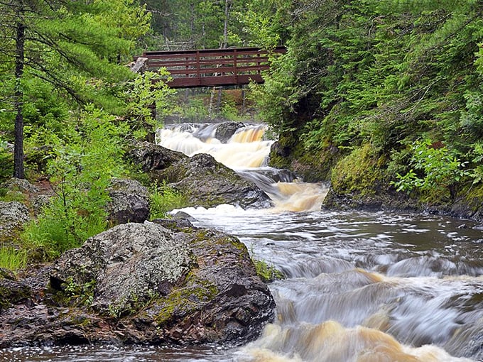 Mother Nature's own waterpark! Cascading falls and a rustic covered bridge create a scene straight out of a Hallmark movie.