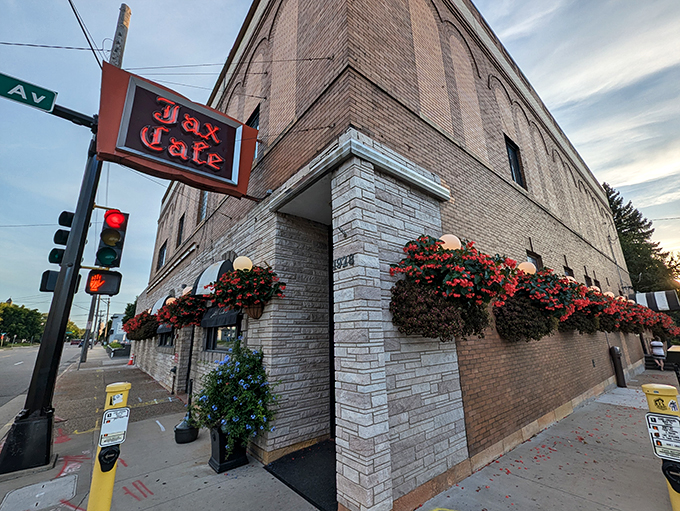 Where neon dreams and flower boxes collide! This brick beauty's been serving up nostalgia since FDR was in office.