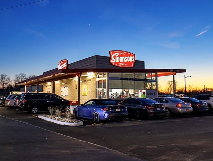 Fast food ninjas in action! Swensons' runners dash between cars, delivering burgers faster than you can say "Great Scott!"