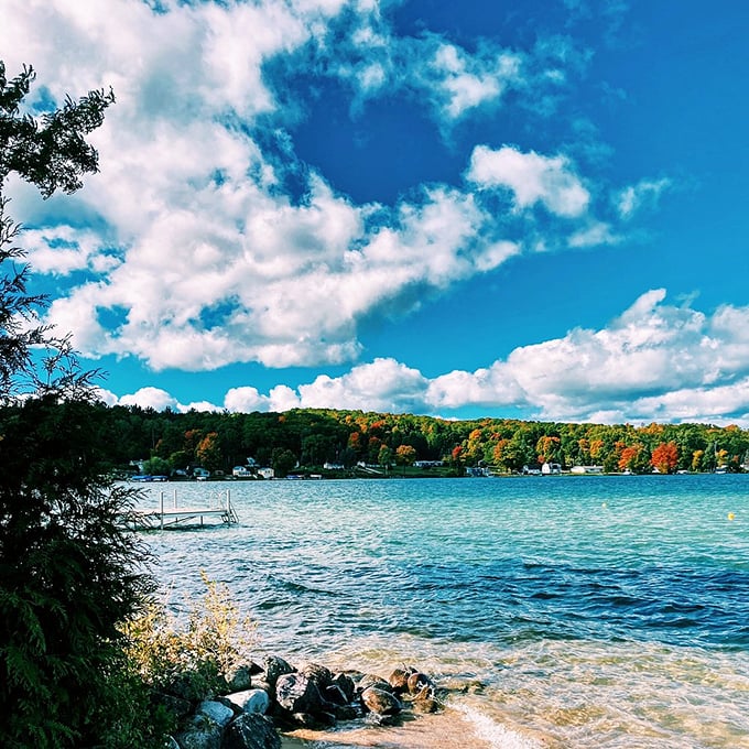 Torch Lake: Caribbean vibes in the Midwest! This turquoise stunner makes you wonder if you've accidentally teleported to Bora Bora.
