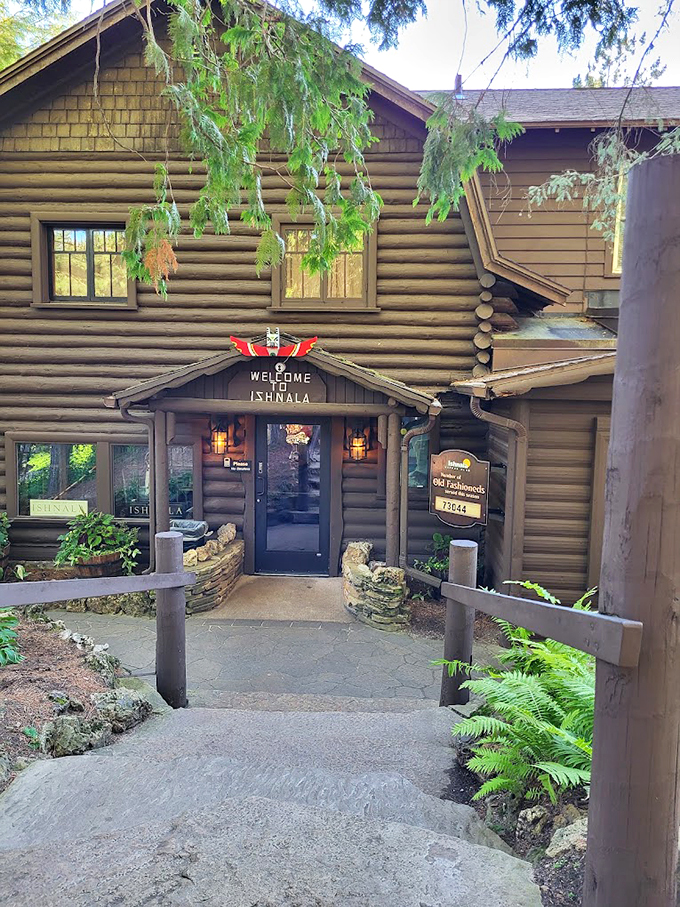 Where rustic charm meets fine dining, complete with towering pines and a welcome sign that promises adventure.