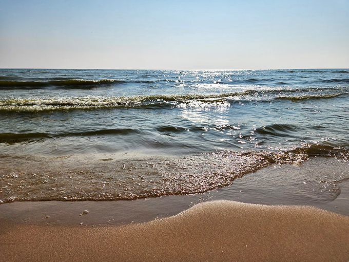 Lake Michigan's crystal waters dance with sunlight, creating a mesmerizing display that rivals any Caribbean postcard.