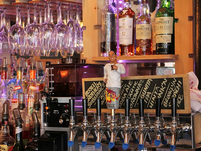 A well-stocked bar with premium spirits stands ready, while a whimsical figurine keeps watch over craft cocktails.