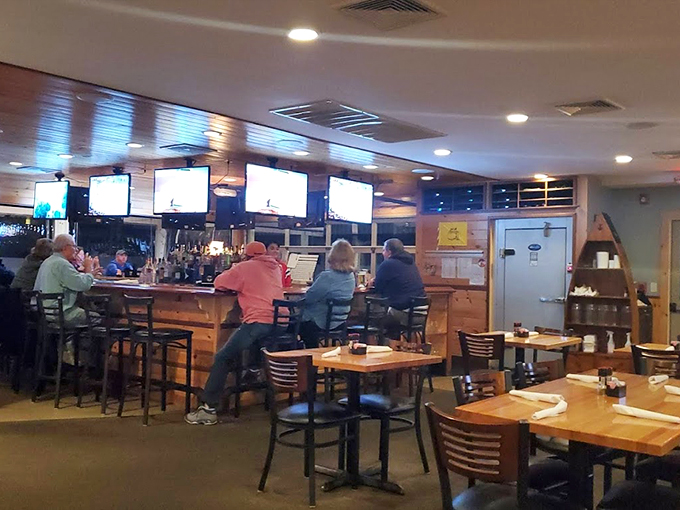 Where Patriots fans and seafood lovers unite: Multiple screens, a well-stocked bar, and Boston sports memorabilia create the quintessential Maine experience. Photo credit: Walter Pedro Moura