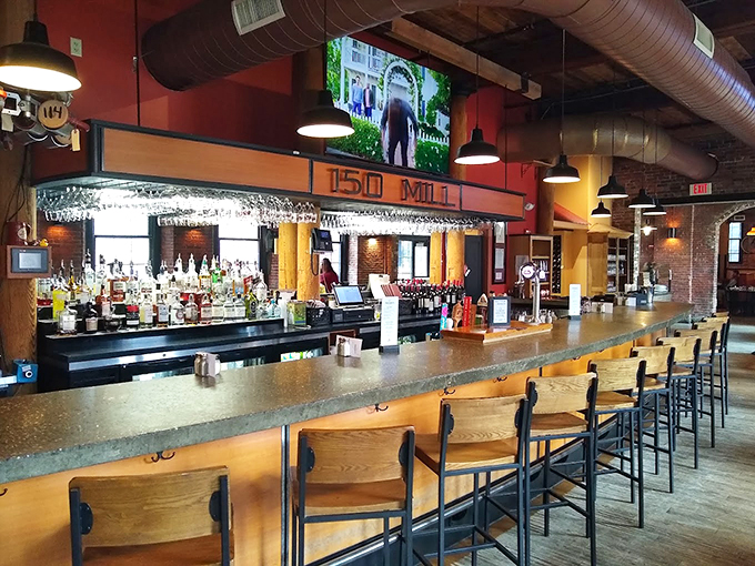 The "150 Mill" bar stretches invitingly beneath sparkling glassware, promising libations worthy of a Medici celebration.