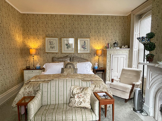 Sweet dreams guaranteed in this botanical haven, where floral wallpaper and plush bedding create a cocoon of historical luxury.