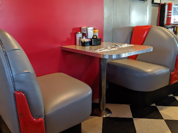 These cozy booths have probably heard more stories than a bartender on New Year's Eve. Perfect for sliding in with your milkshake. Photo credit: Lori M-H