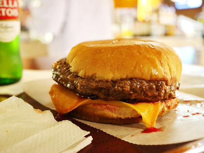 Pure poetry on a bun&mdash;melted cheese cascades over a perfectly grilled patty, proving sometimes the simplest things are life's greatest pleasures.