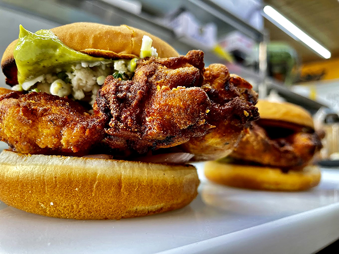 These aren't just chicken sandwiches &ndash; they're crispy, golden-brown masterpieces that would make Colonel Sanders hang up his white suit in defeat. Photo credit: Backwoods Burger Shack