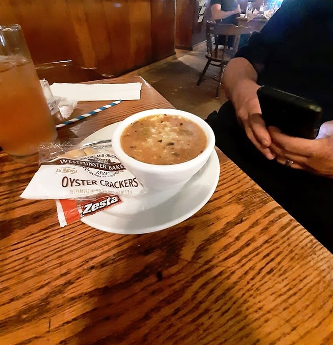 Friday's legendary chowder arrives with oyster crackers, like a warm hug in a bowl for Michigan's chilly evenings.