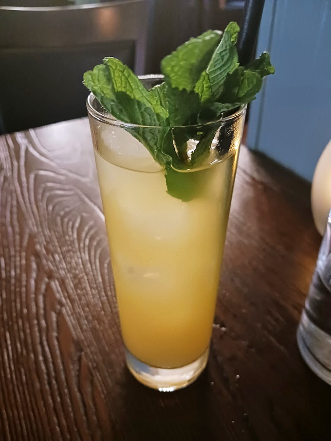 This isn't just any cocktail - it's summer in a glass, crowned with fresh mint and promising refreshing escape.