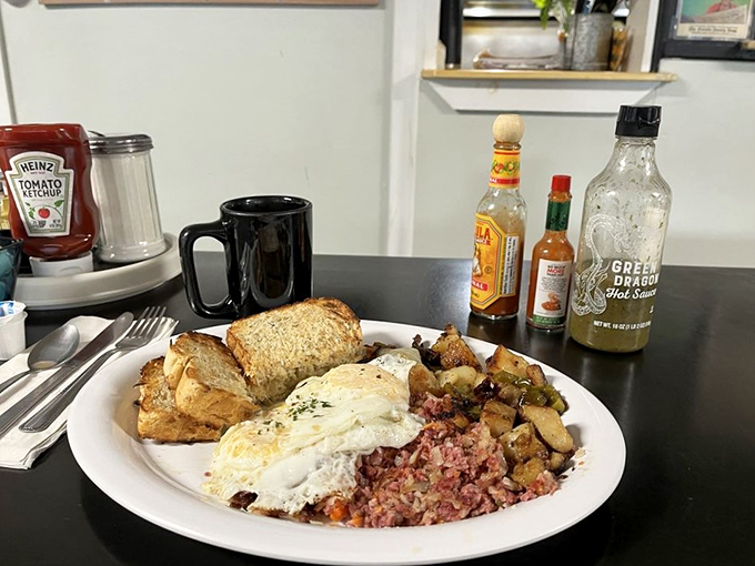 This isn't your average hash - it's a masterpiece of crispy potatoes and tender corned beef, crowned with perfectly runny eggs.